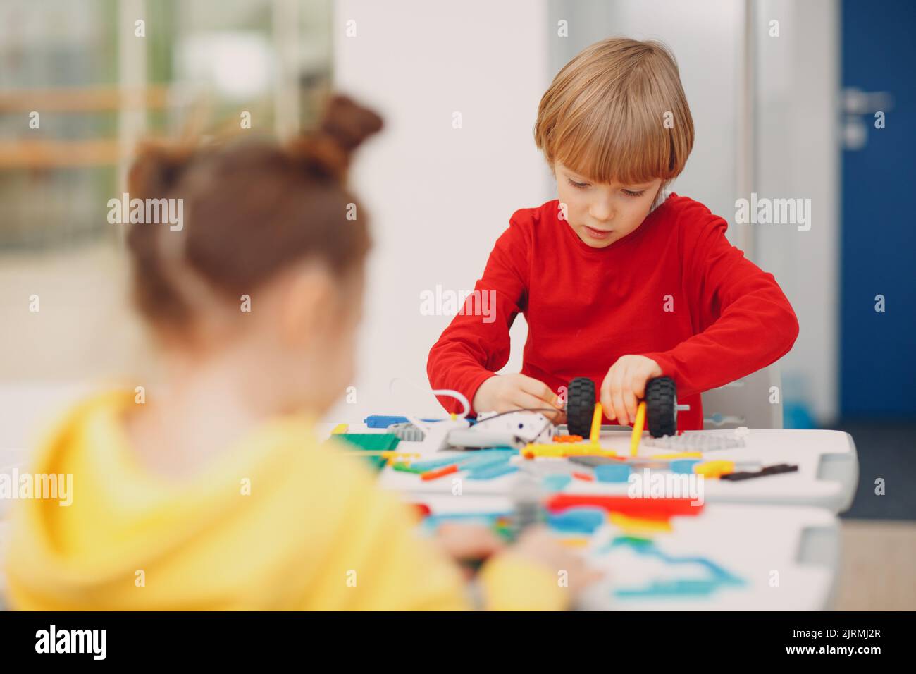 Couple kids child constructor checking technical toy. Children Robotics ...