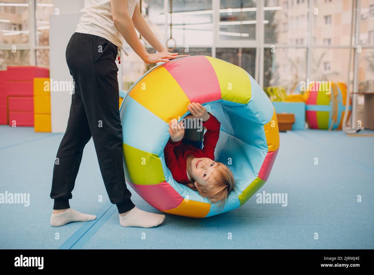 Kids playing in gym at kindergarten or elementary school. Children ...