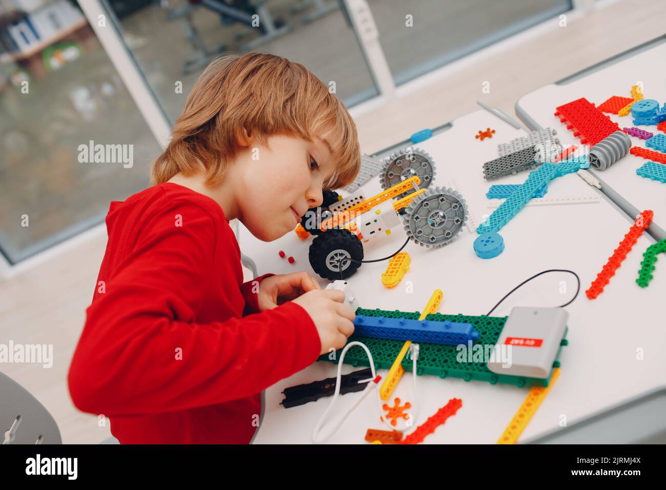 Little boy kid child constructor checking technical toy. Children ...