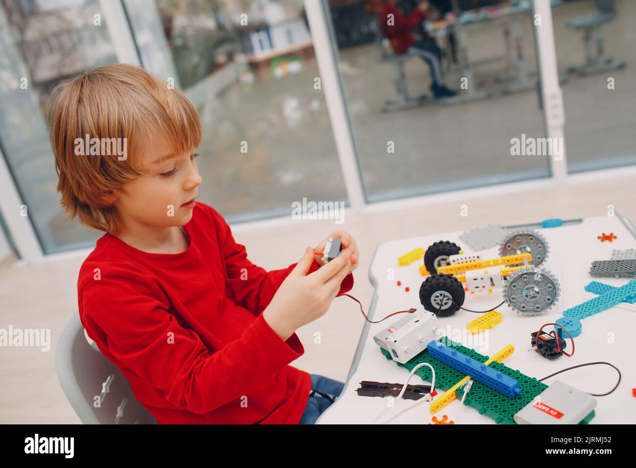 Little boy kid child constructor checking technical toy. Children ...