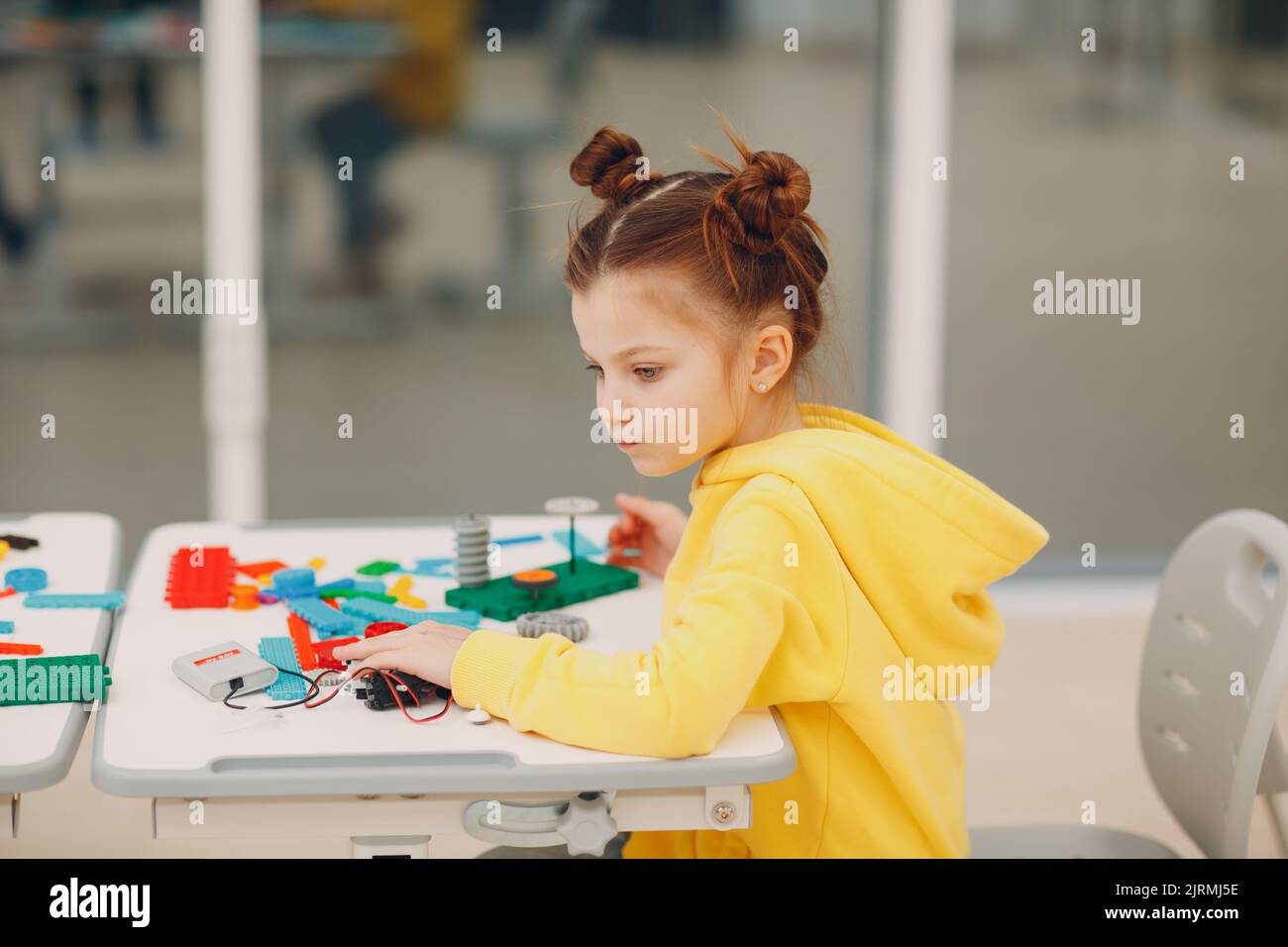 Little girl kid child constructor checking technical toy. Children ...