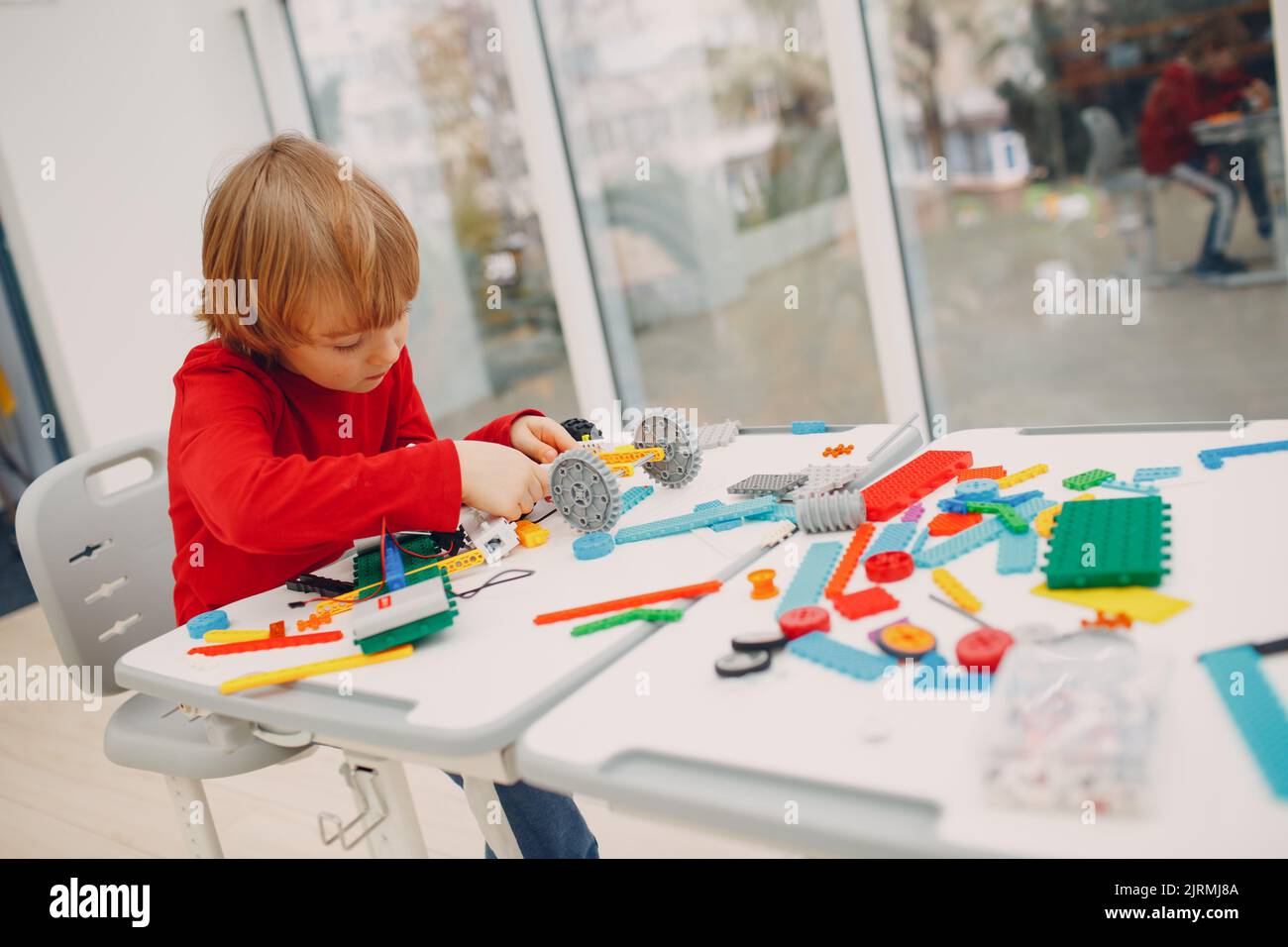 Little boy kid child constructor checking technical toy. Children ...