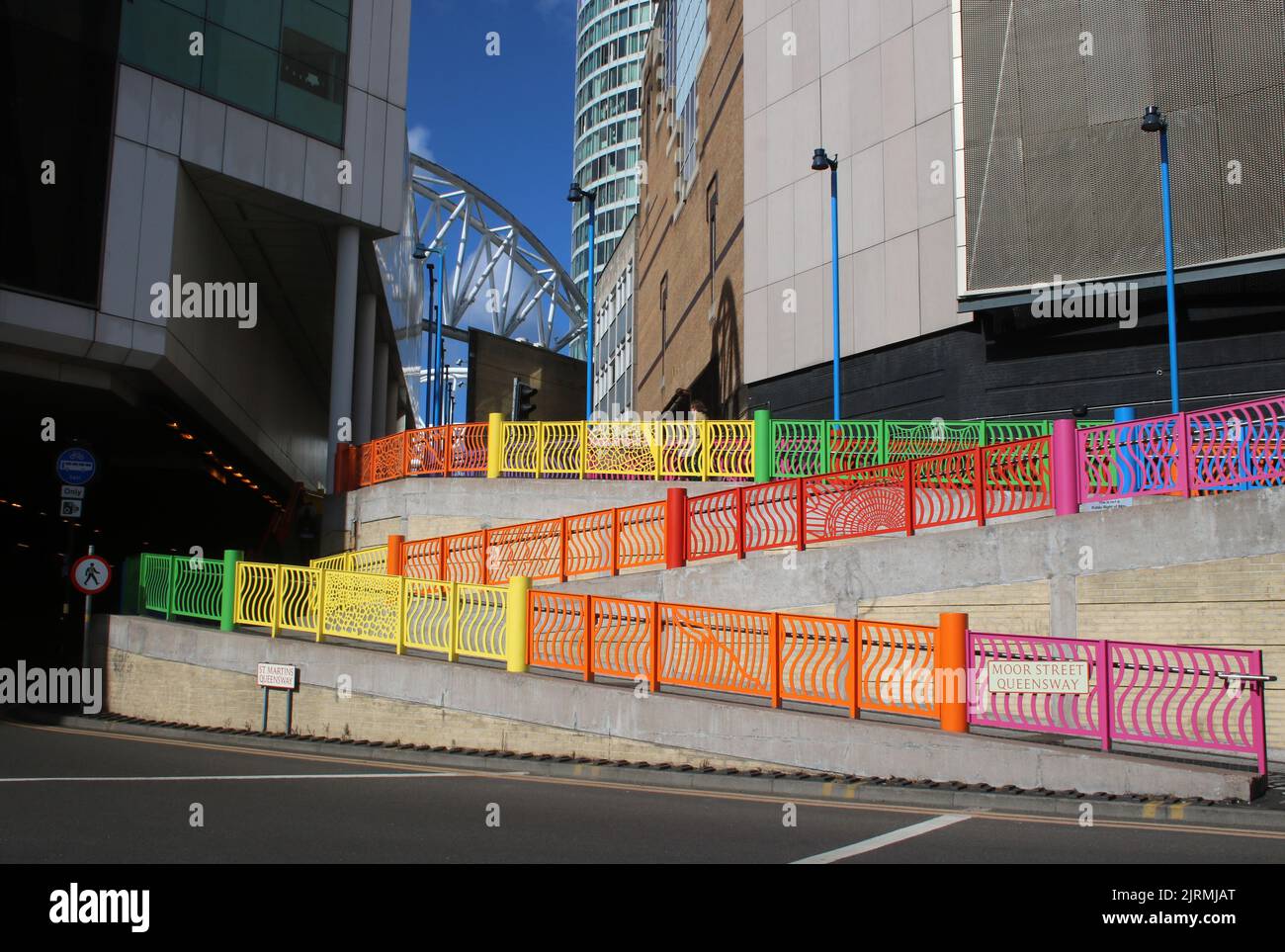 Multicolored railings on pedestrian walkway from area outside Moor ...