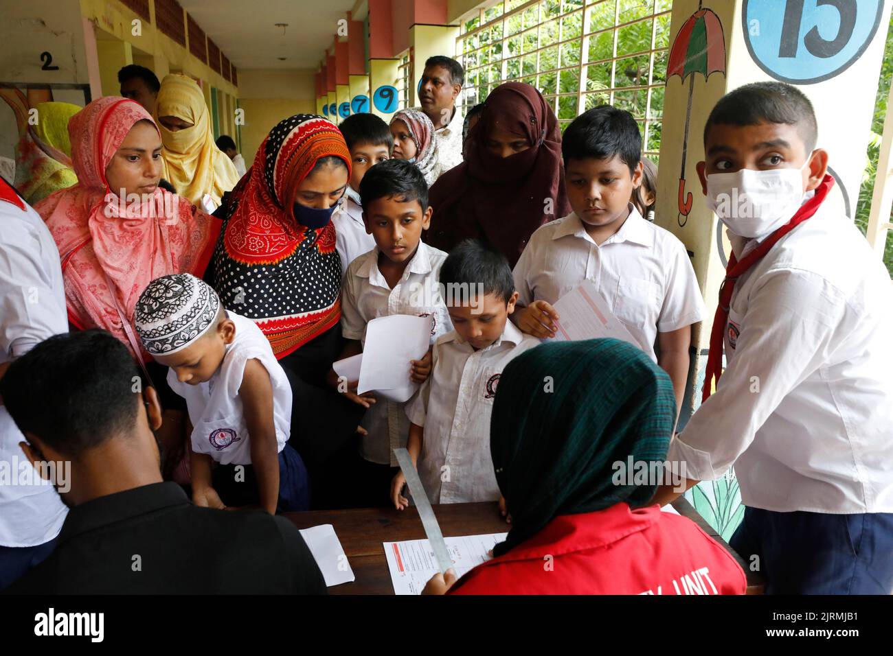 Dhaka, Bangladesh - August 25, 2022: A child gets his first dose of the COVID-19 vaccine at ...