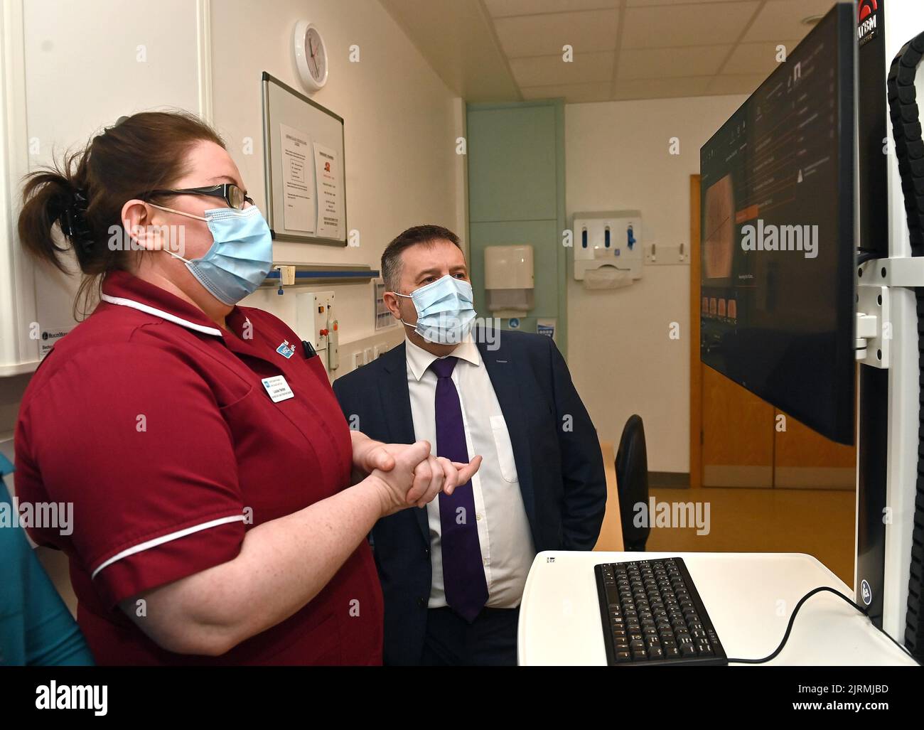 Health Minister Robin Swann along with Louise Harden, McMillan skin ...