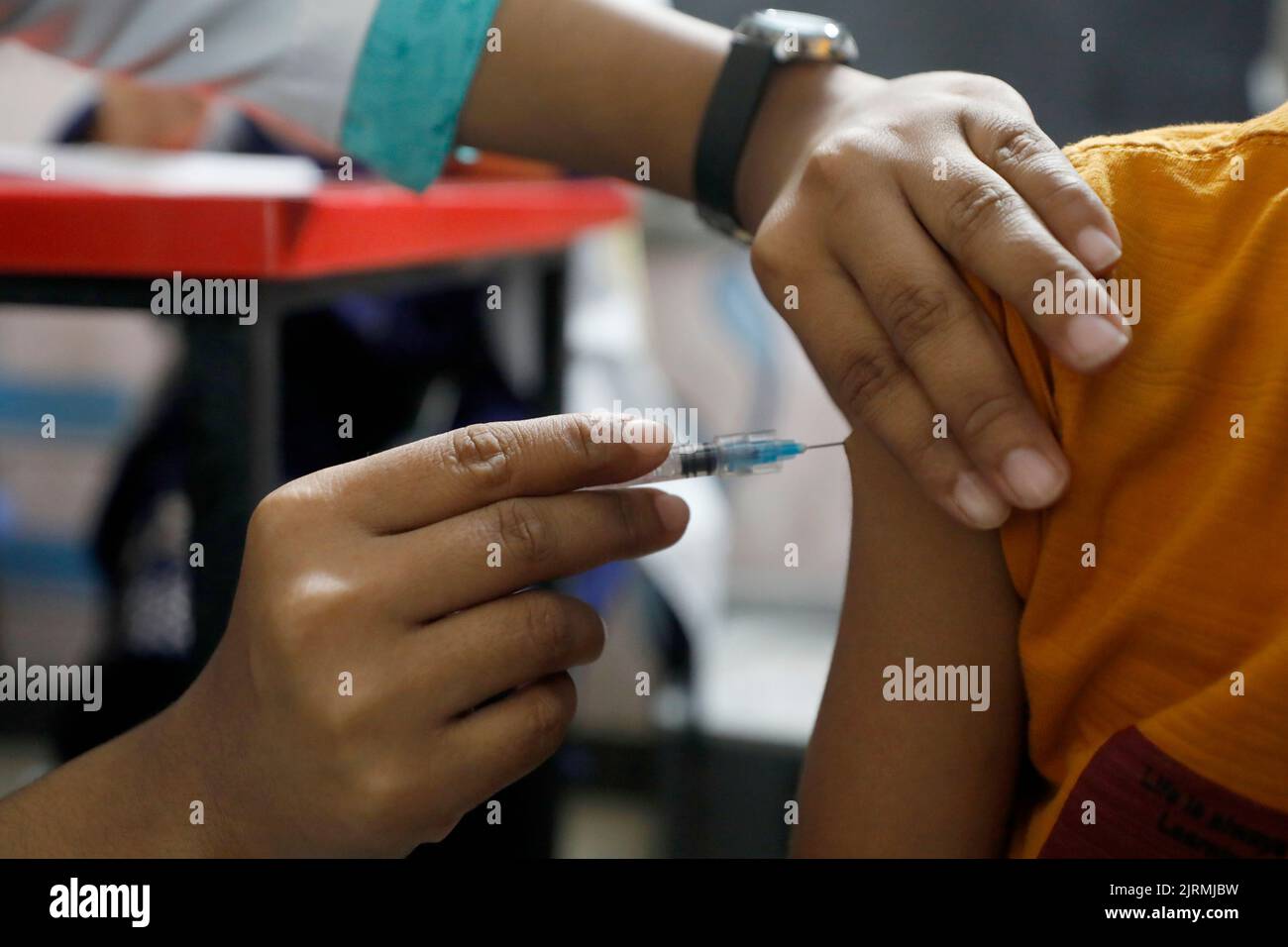Dhaka, Bangladesh - August 25, 2022: A child gets his first dose of the ...
