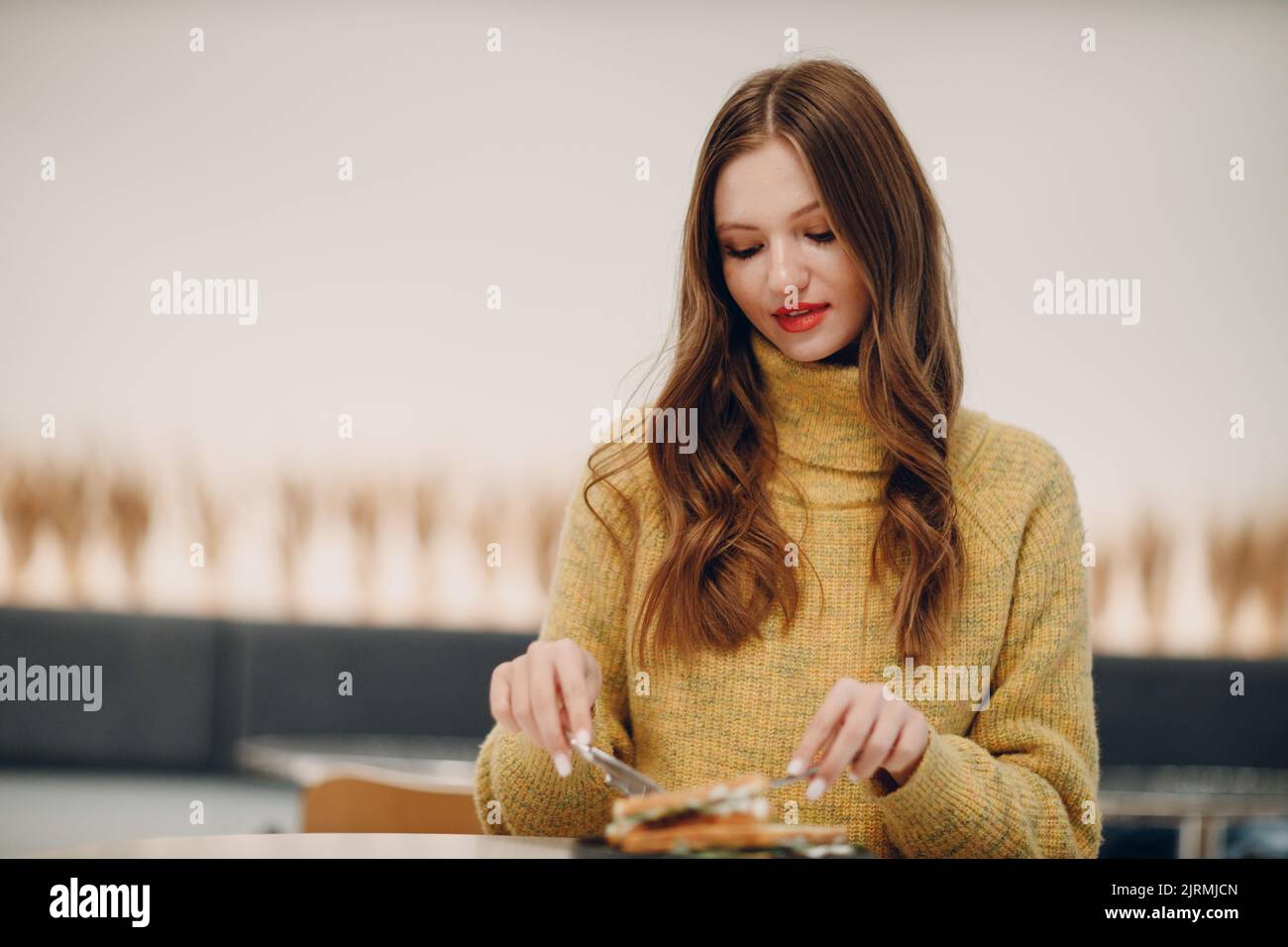 Woman holding sandwich table hi-res stock photography and images - Alamy