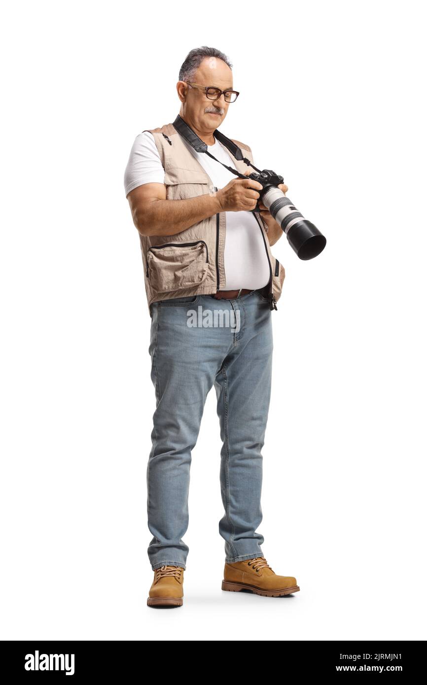 Full length shot of a mature male photographer looking at a camera ...