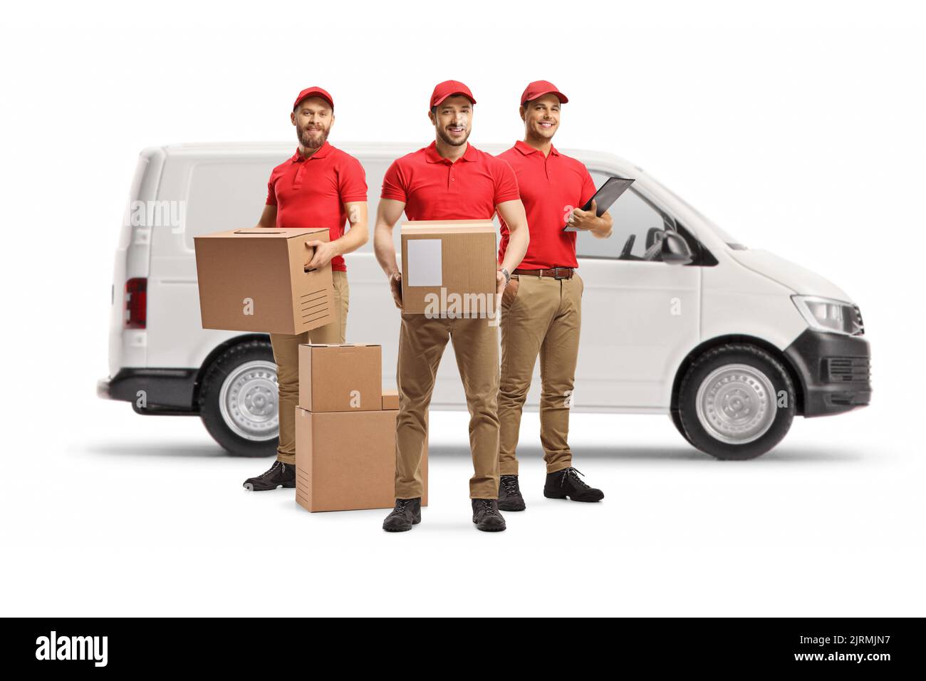 Male couriers with cardboard boxes standing in front of a white van ...