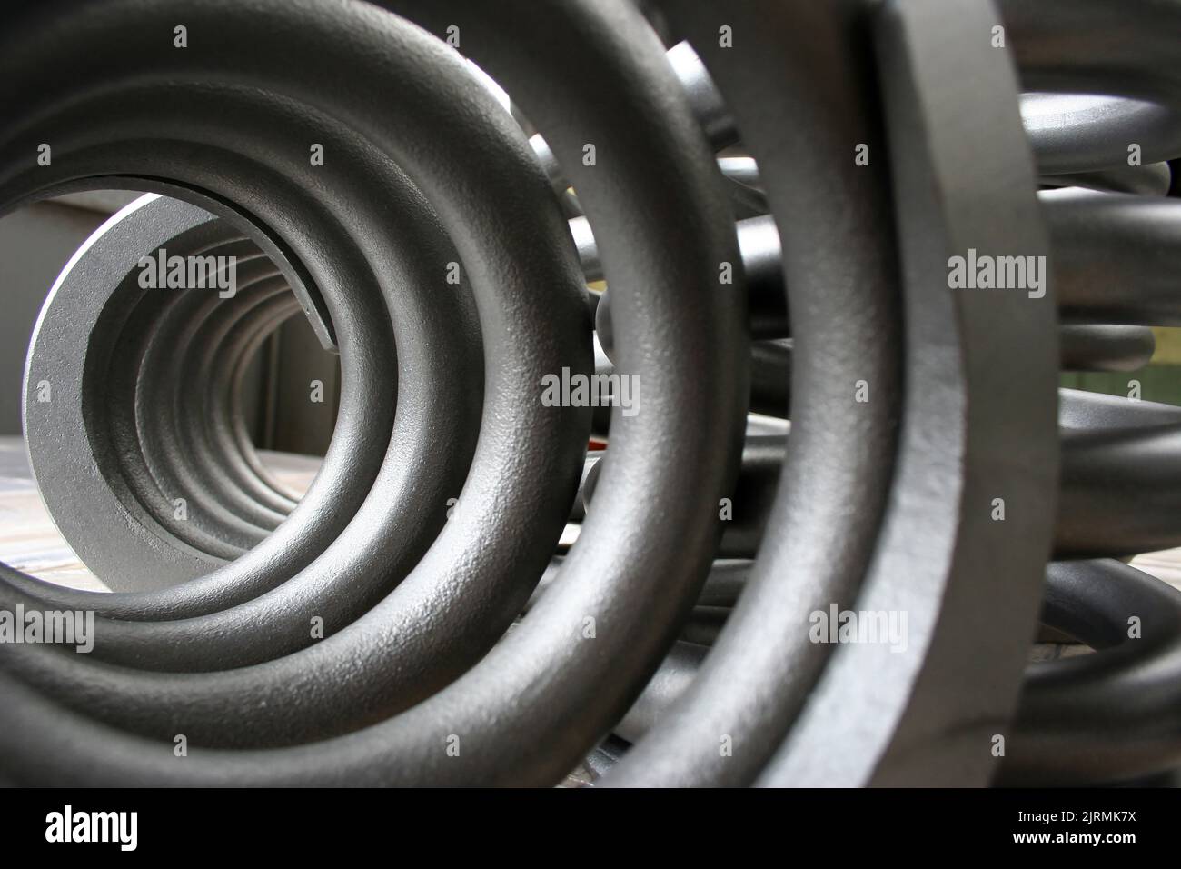 large steel springs inside the factory Stock Photo - Alamy