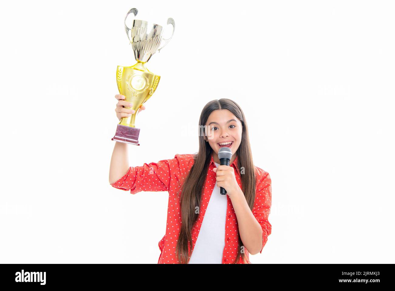 Teenage girl with win cup microphone speech. Teen holding a trophy. Kid ...