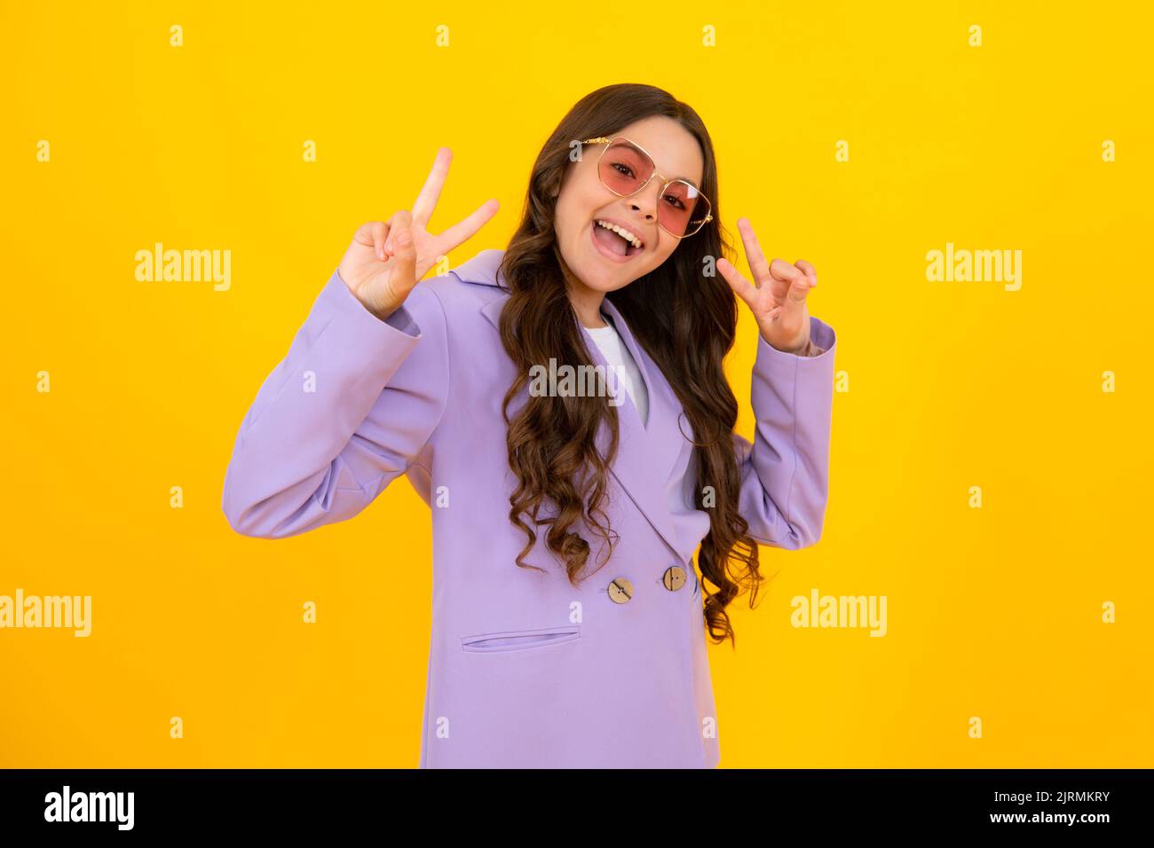 Amazed teen girl. Cute teen girl showing fingers doing victory sign ...