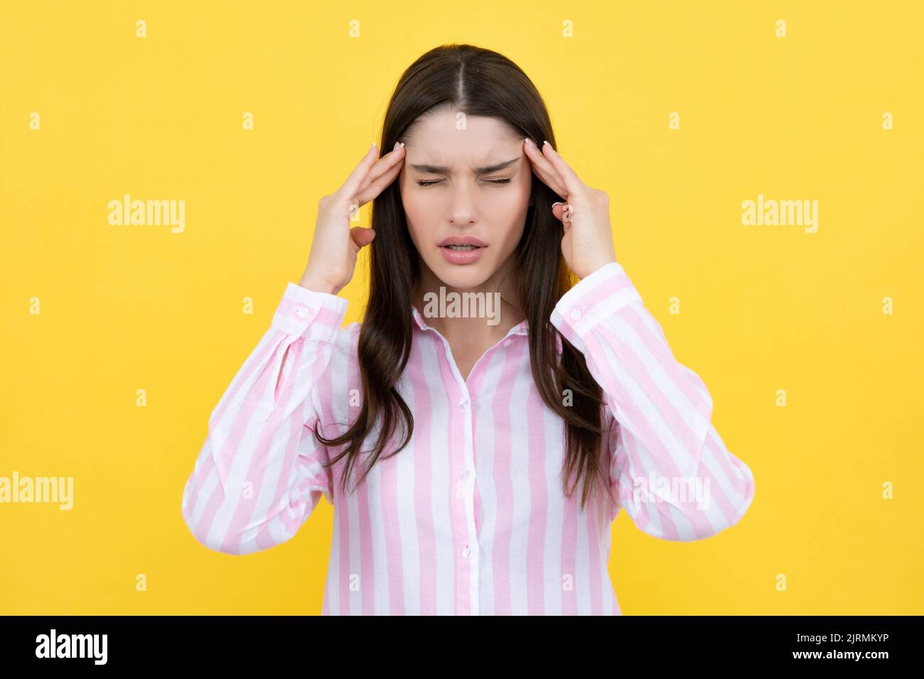 Portrait of young woman feeling stress or strain headache. Exhausted ...