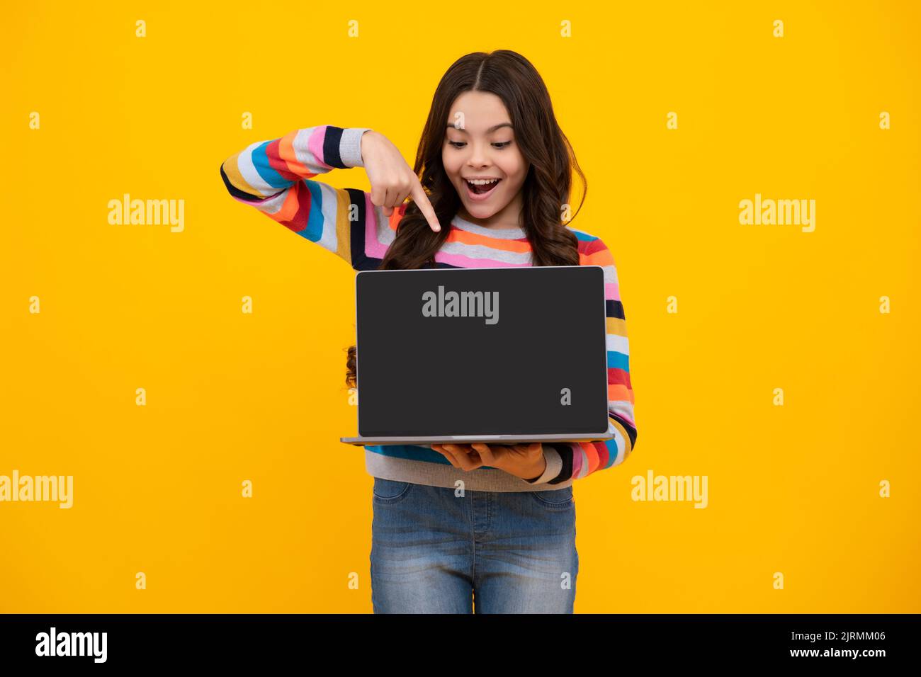 Amazed teenager. Teenager school girl hold notebook laptop. Screen of ...