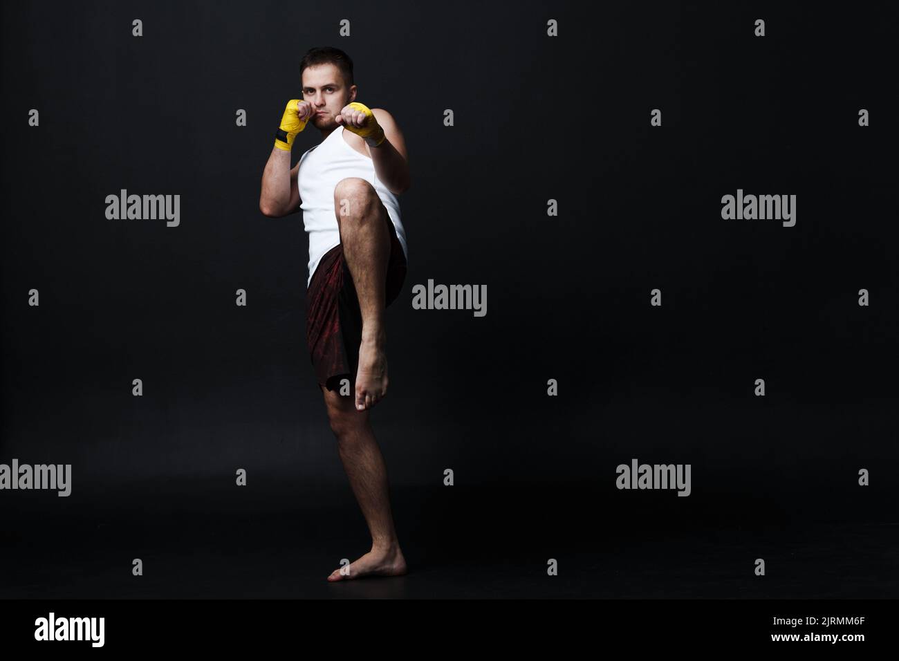 Sportsman muay thai man boxer stance at black background Stock Photo ...