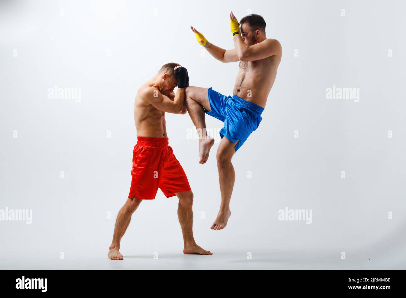 Two men boxers fighting muay thai boxing white background Stock Photo ...