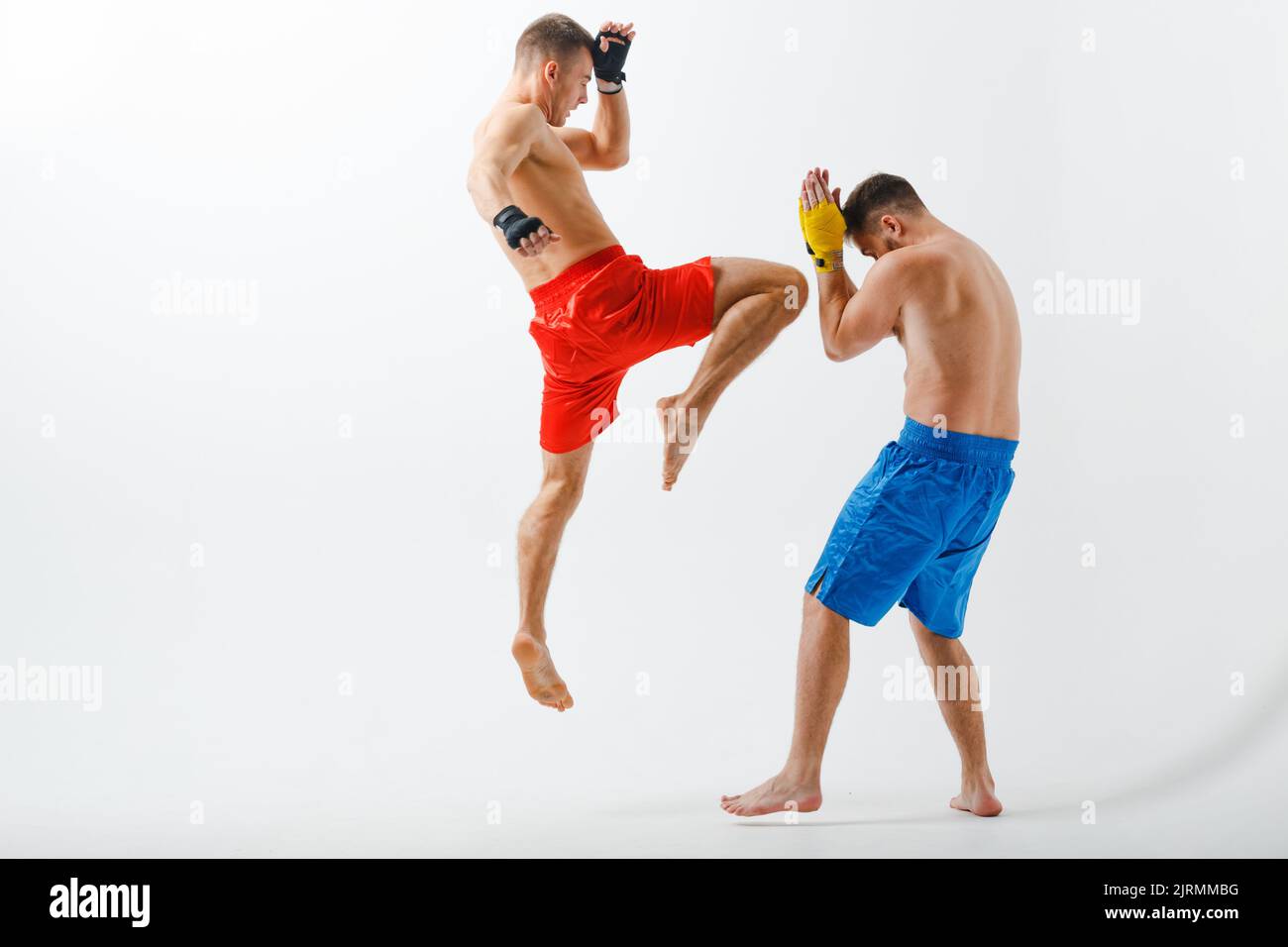 Two men boxers fighting muay thai boxing white background Stock Photo ...