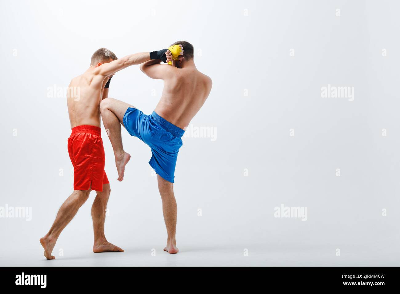 Two men boxers fighting muay thai boxing white background Stock Photo ...