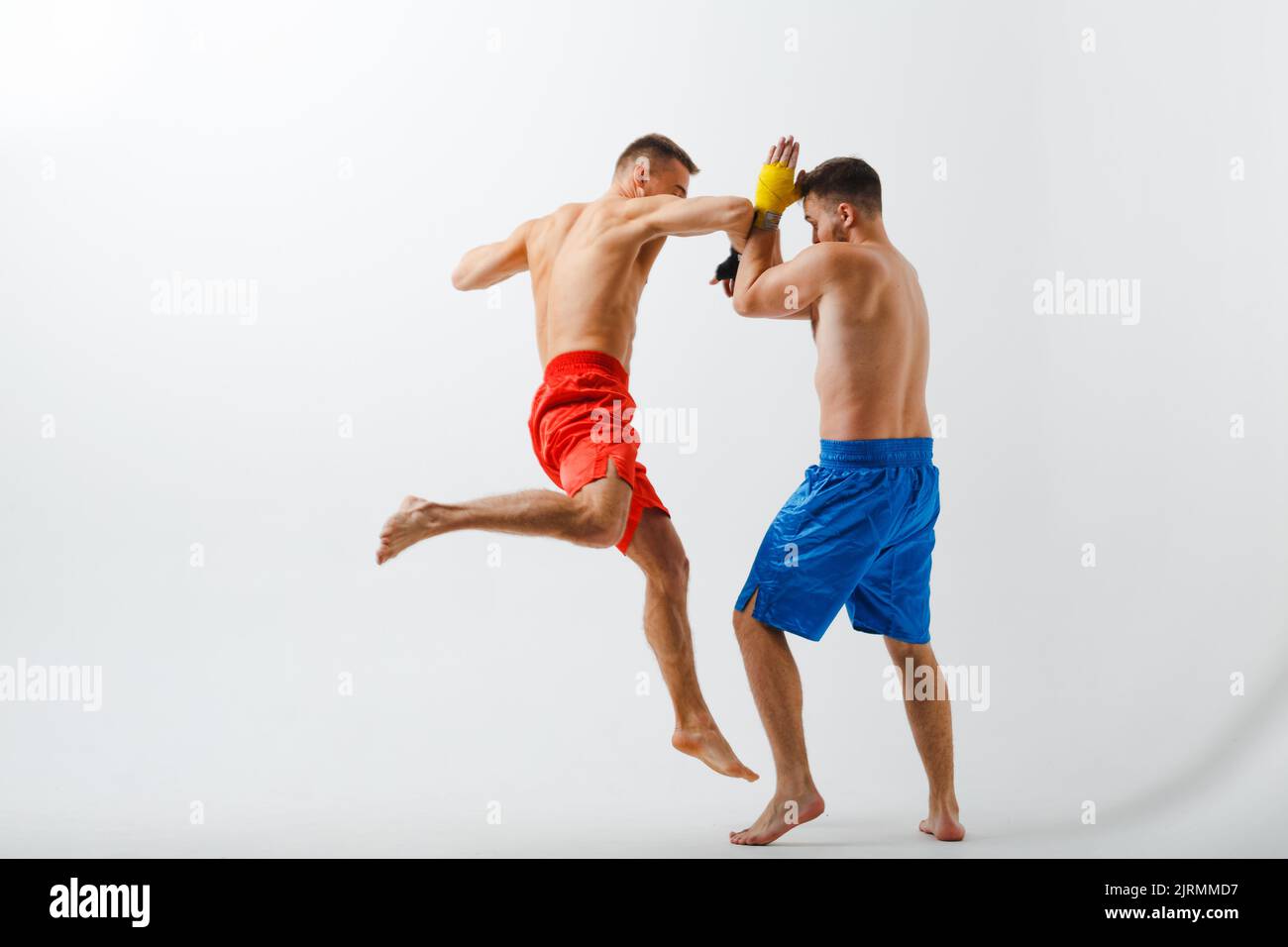 Two men boxers fighting muay thai boxing white background Stock Photo ...