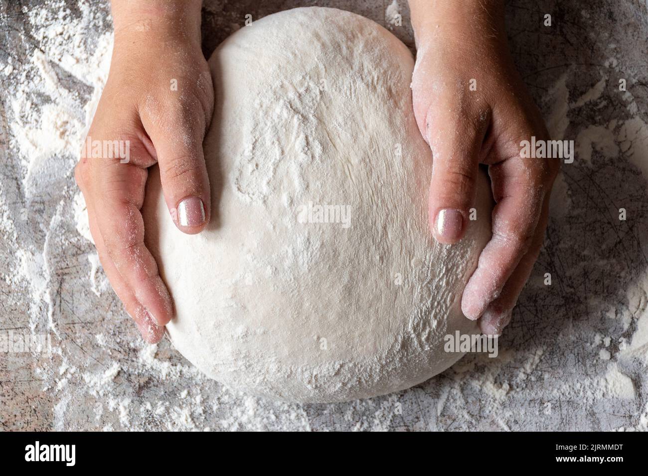 Baker kneading fresh dough hi-res stock photography and images - Alamy