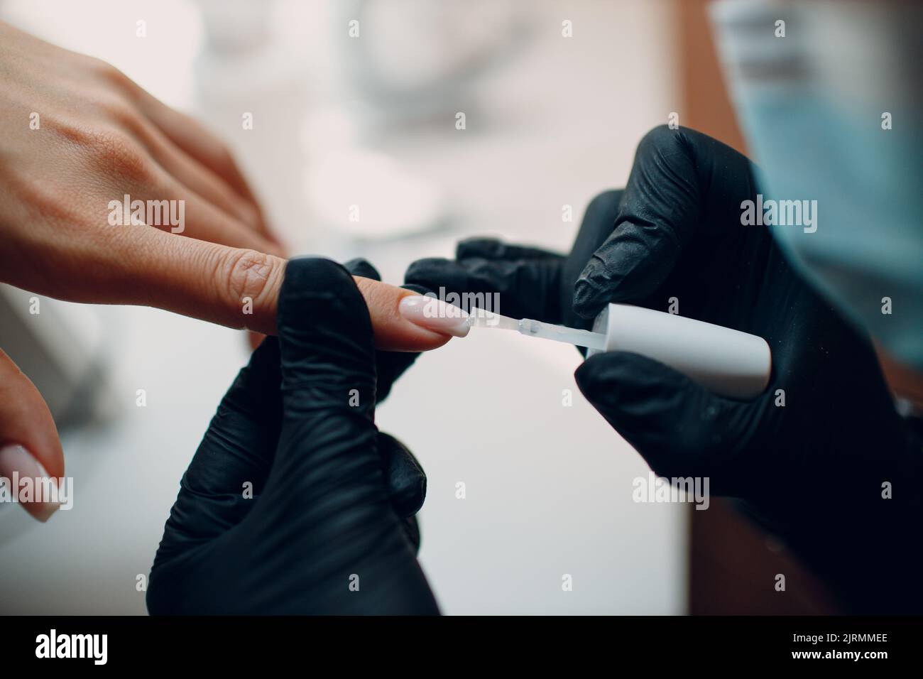 Manicure process female hands finger nails polish Stock Photo - Alamy