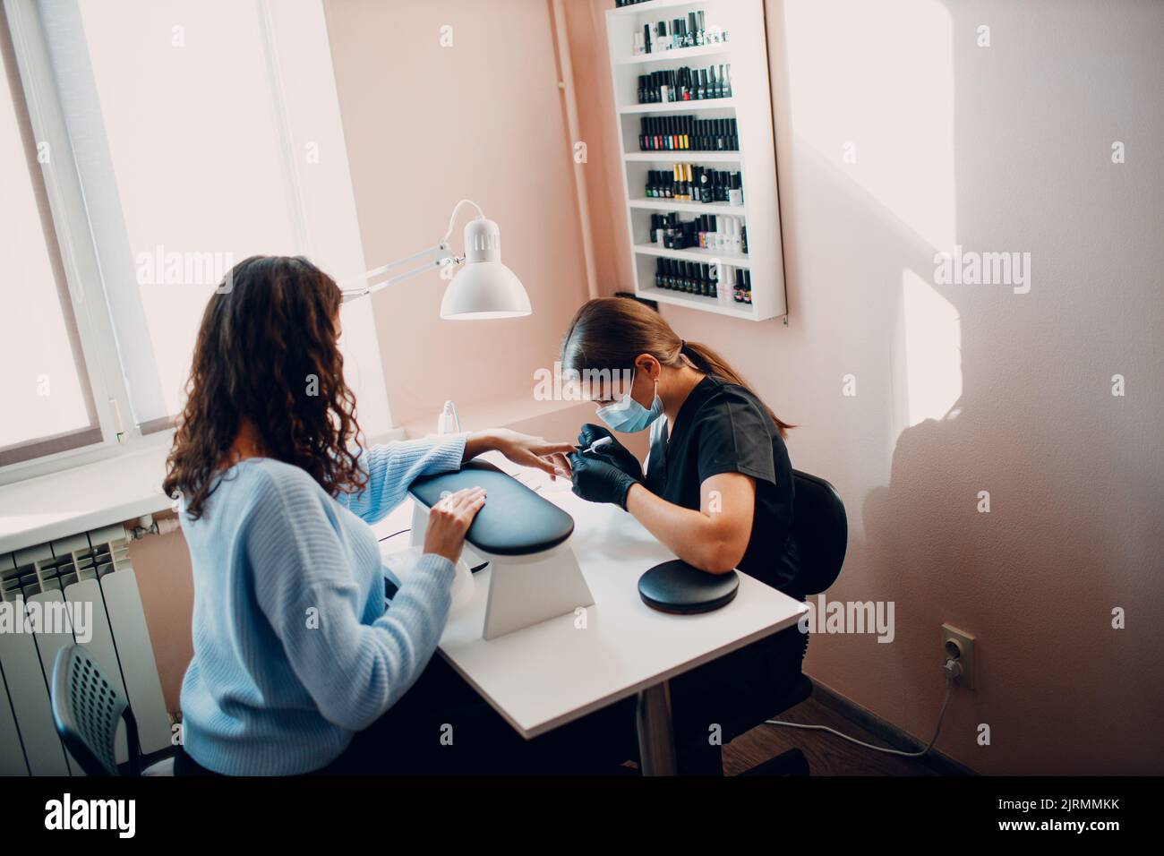 Manicure process female hands finger nails polish Stock Photo - Alamy