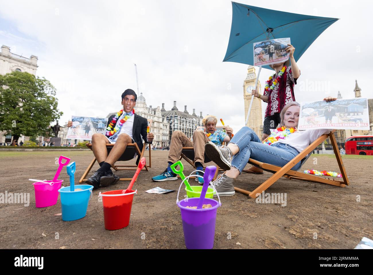 Campaigners wearing masks of Conservative MPs, including Prime Minister ...