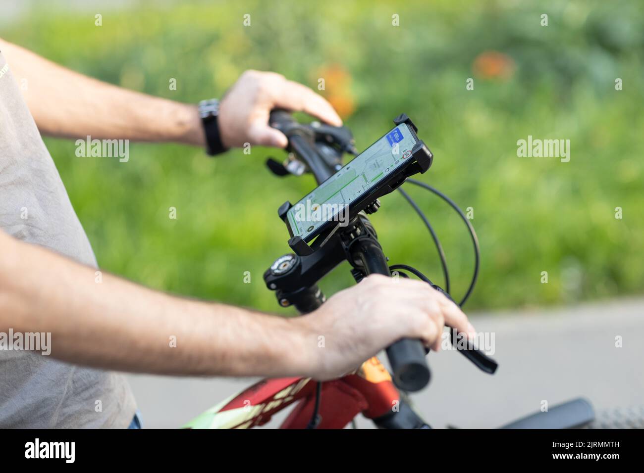 Man Planning Route Using Gps Navigation Application In Mobile Phone On