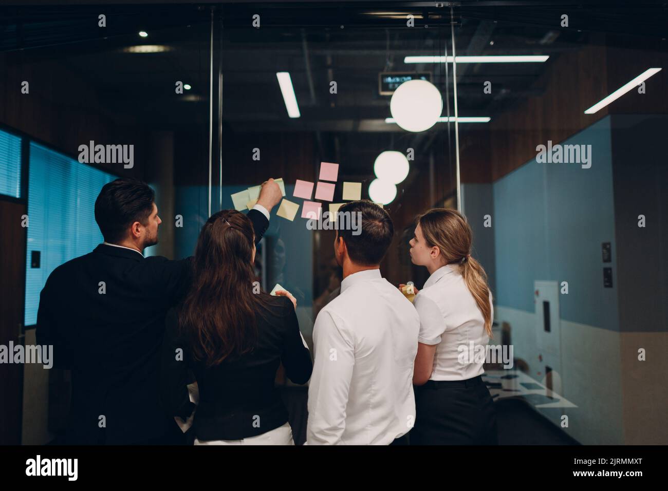 Business office team people molded on glass sticky note stickers rear ...