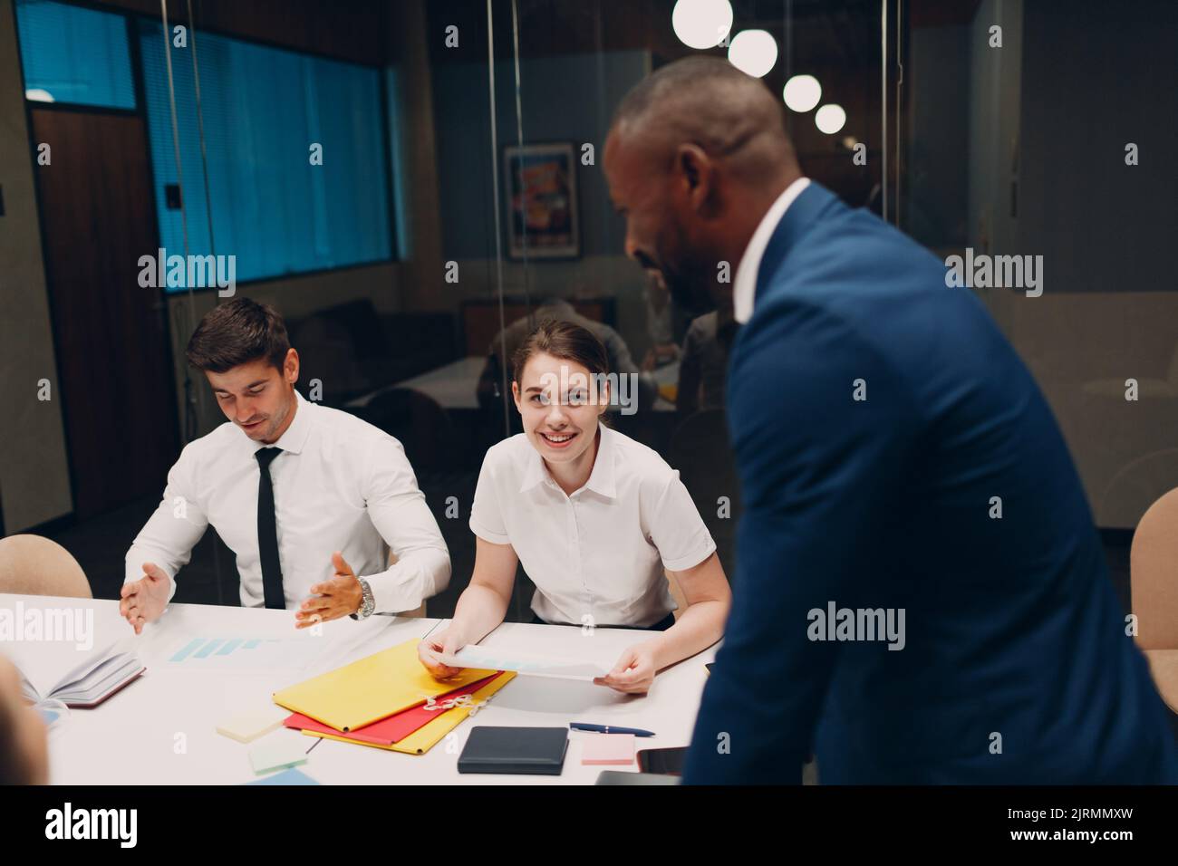 Businessman and businesswoman team at office meeting. Business people ...