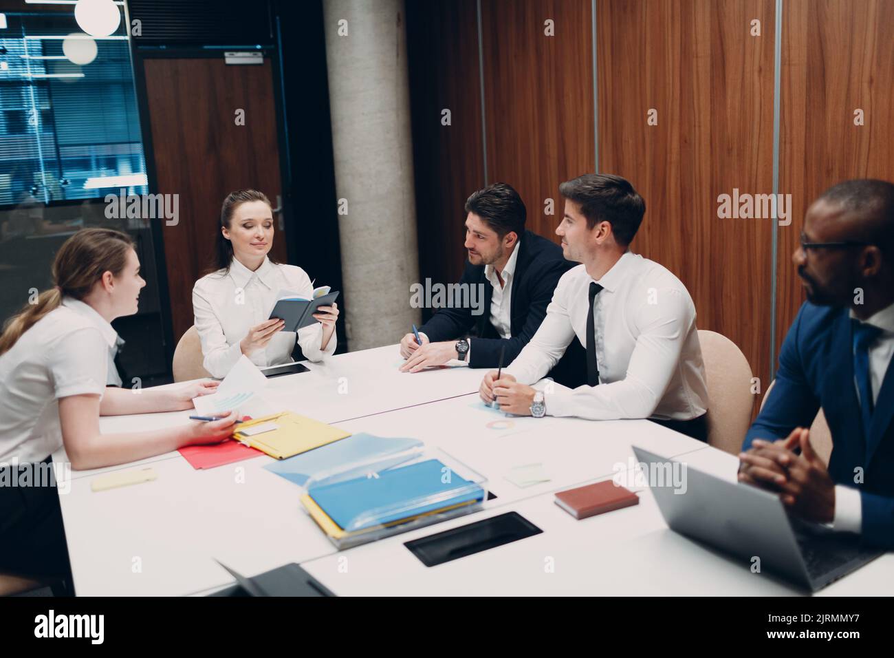 Businesswoman boss and business team at office meeting. People group ...