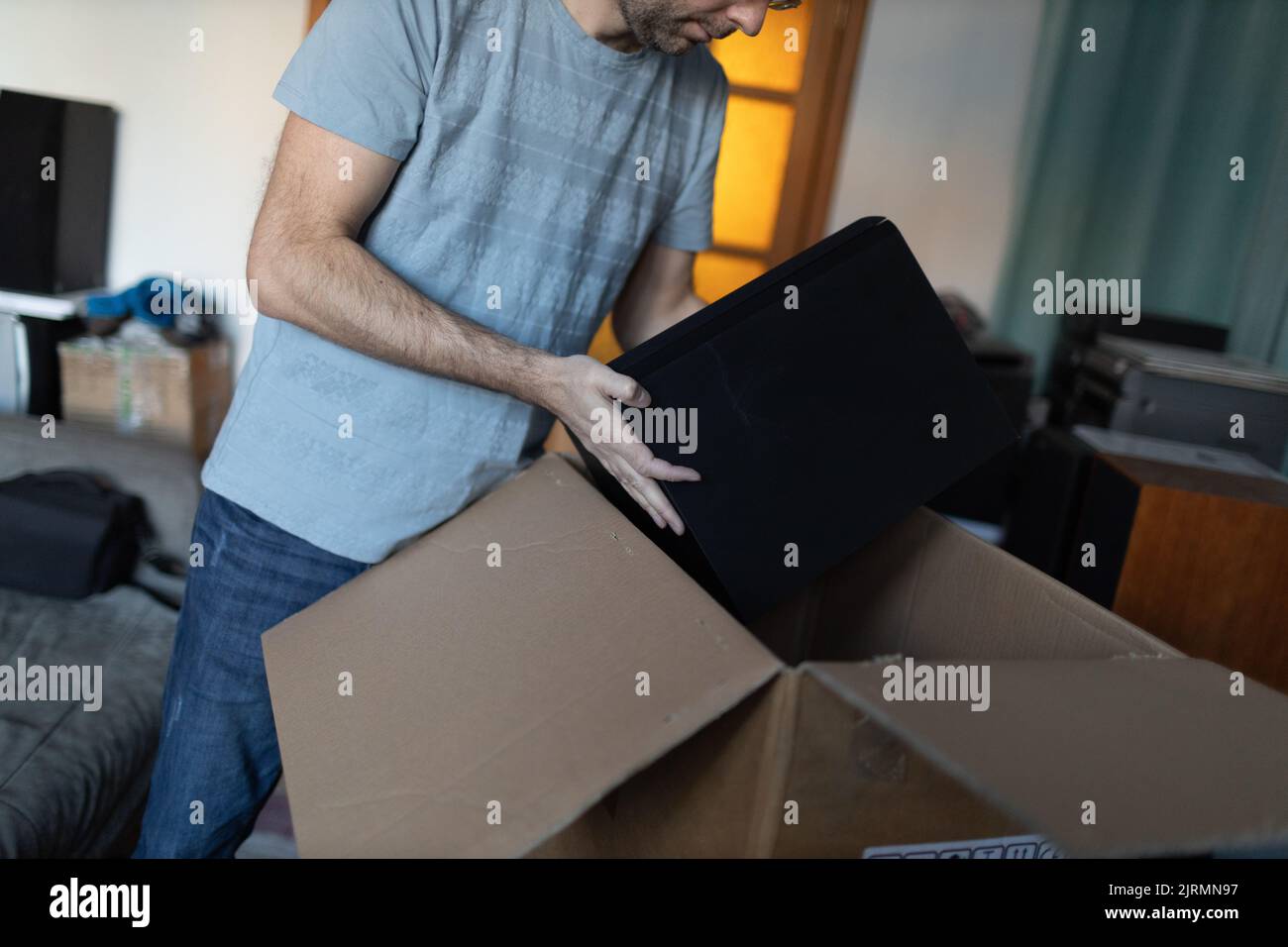 Adult man small business owner packing order box package shipping to ...