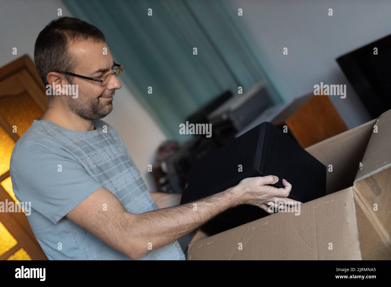 Adult man small business owner packing order box package shipping to ...