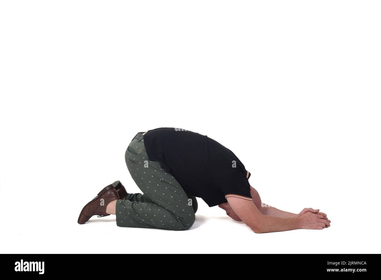 man with head on floor and arms outstretched on white background Stock ...