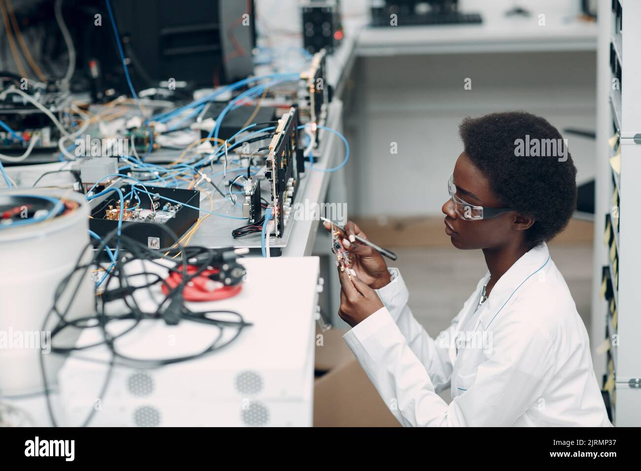 Scientist african american woman working in laboratory with electronic ...