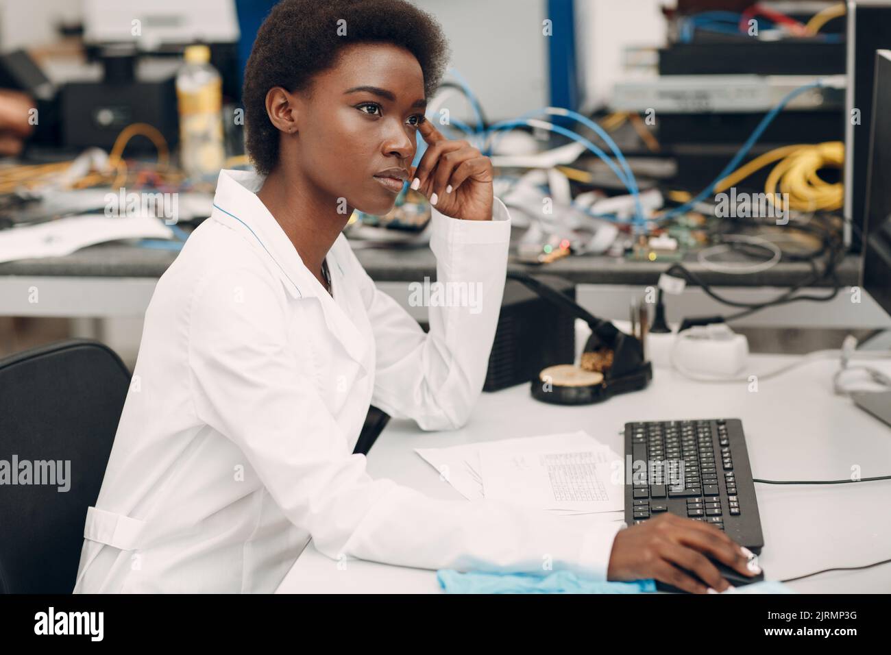Scientist african american woman working in laboratory with computer ...