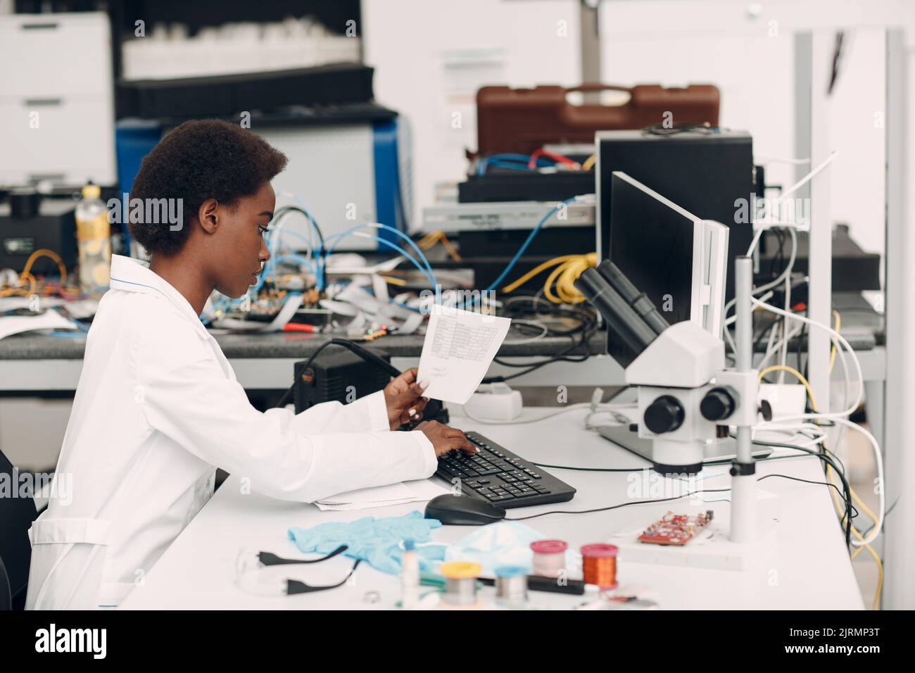 Scientist african american woman working in laboratory with computer ...