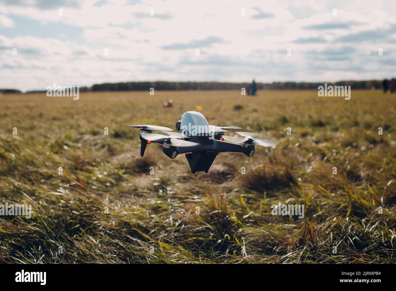 Big quadcopter drone on aerial flight and filming Stock Photo - Alamy