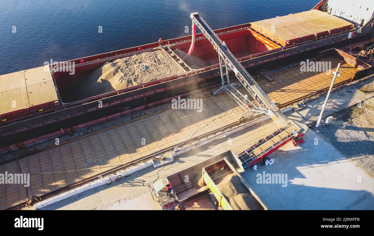 Aerial view of big grain elevators on the sea. Loading of grain on ship ...