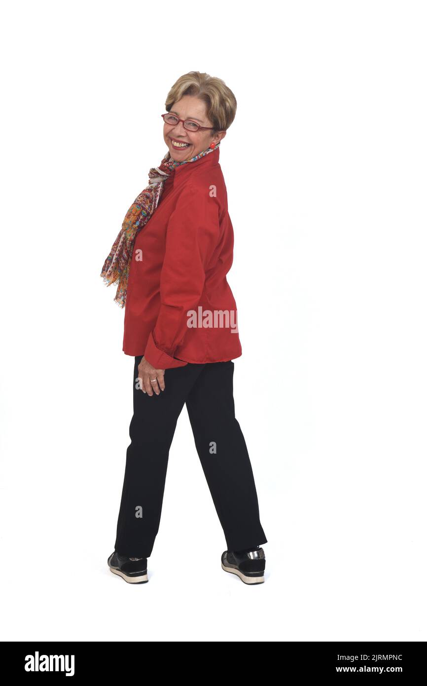 full portrait of a senir woman tourned around on white background Stock ...