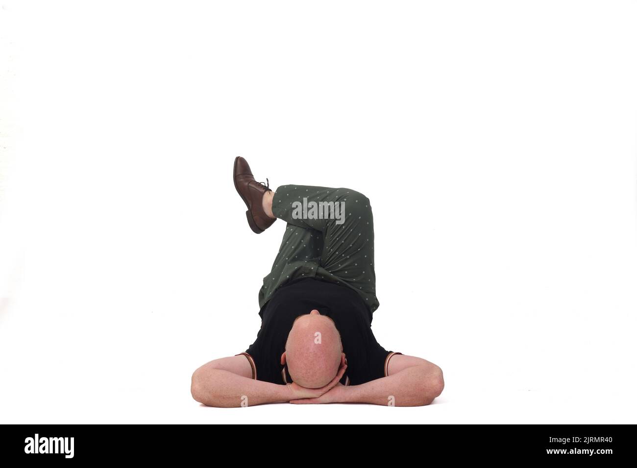 man lying on the floor relaxed with his hands behind his neck and his ...