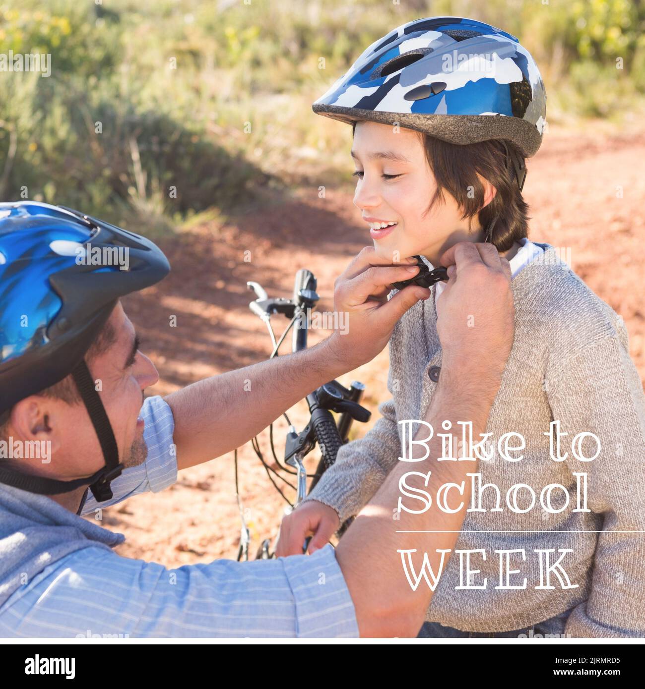 Digital image of loving father adjusting caucasian son's bicycle helmet ...