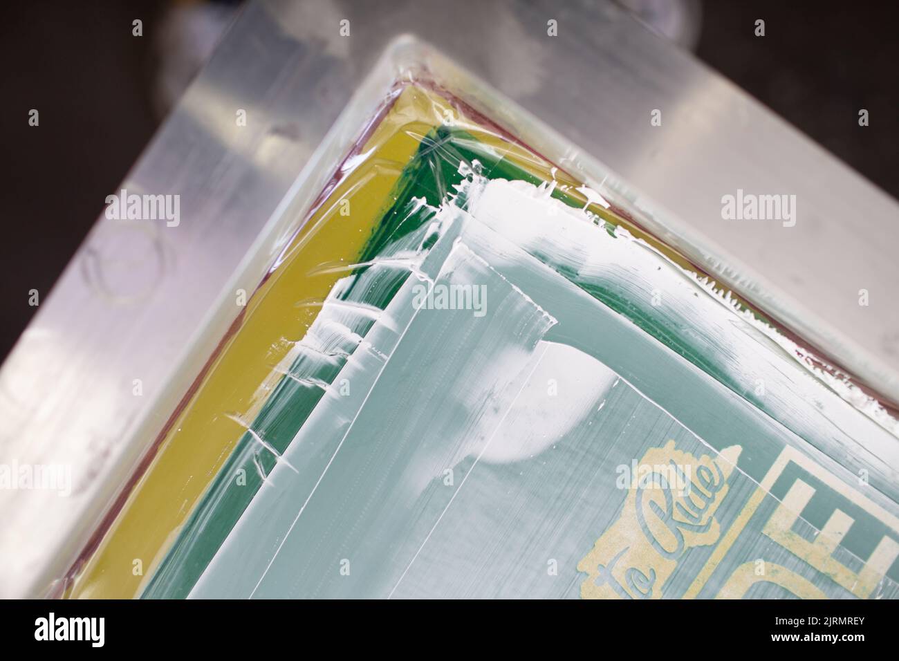 Serigraphy silk screen print process at clothes factory. Frame ...