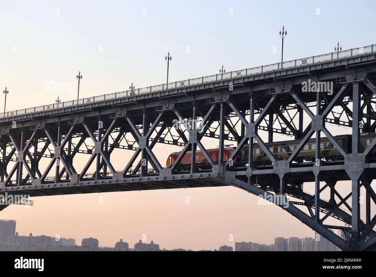 Beautiful sunset behind Nanjing Yangtze River Bridge with a train ...