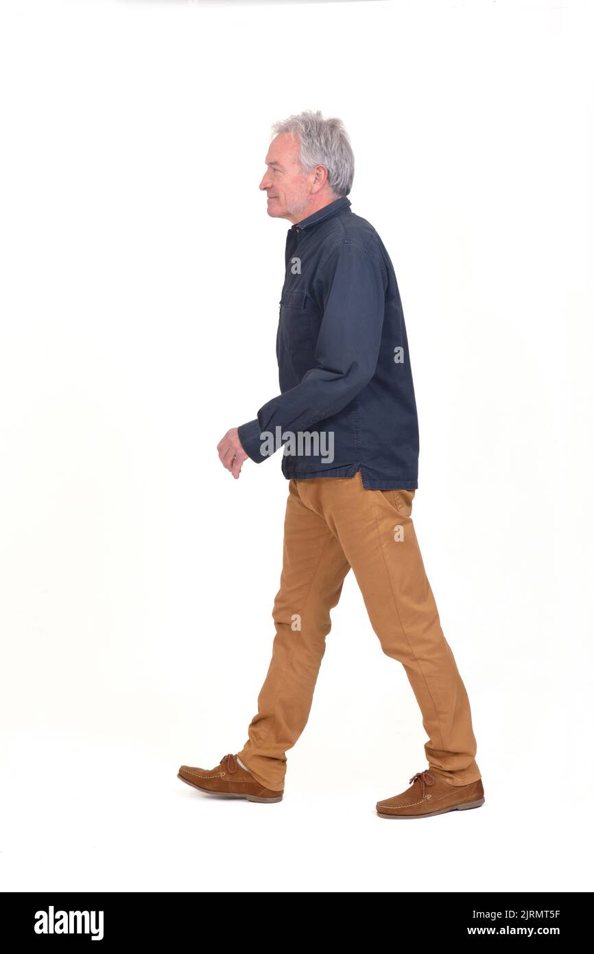 side view of a man walking on white background on white background ...