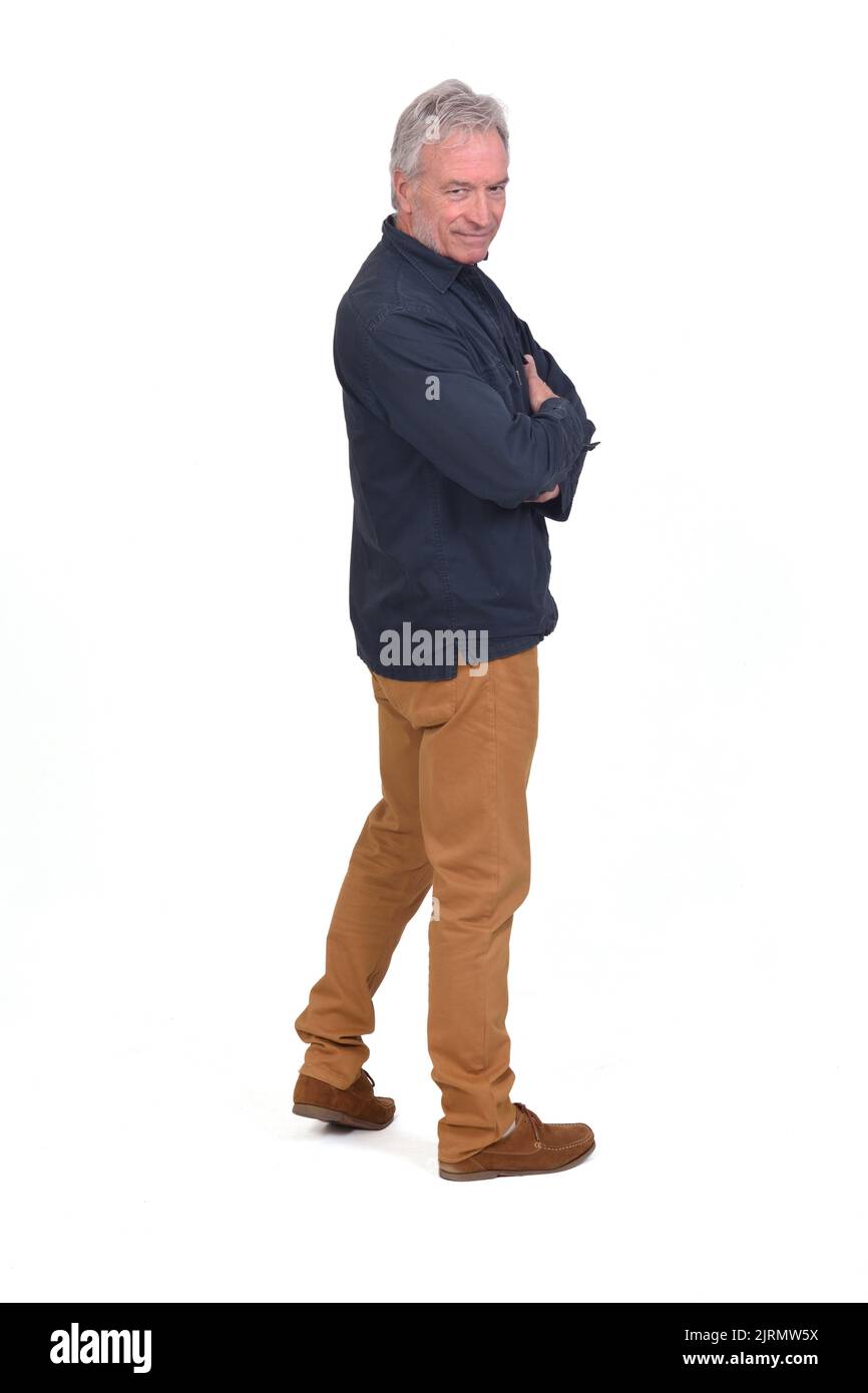 rear view of a man with arms crossed turning around on white ...