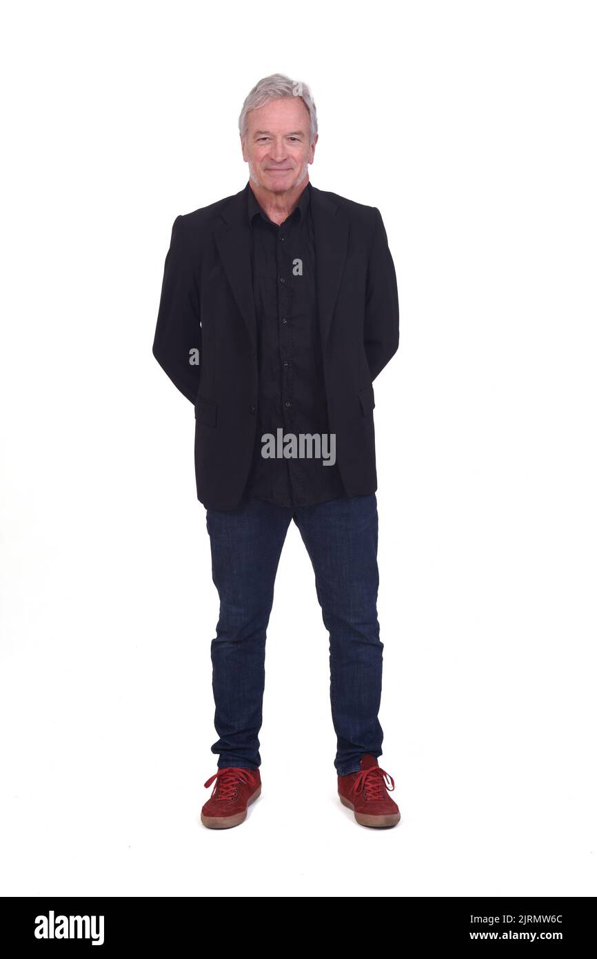 front view of man dressed in jeans sneakers and blazer with hands on ...