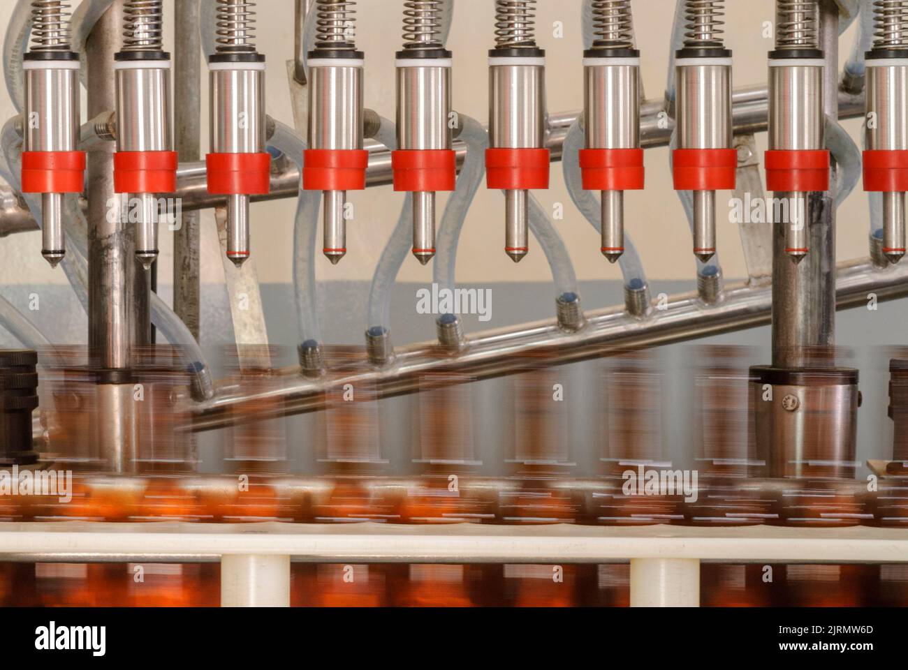 Bottling of alcoholic beverage in the industry Stock Photo - Alamy