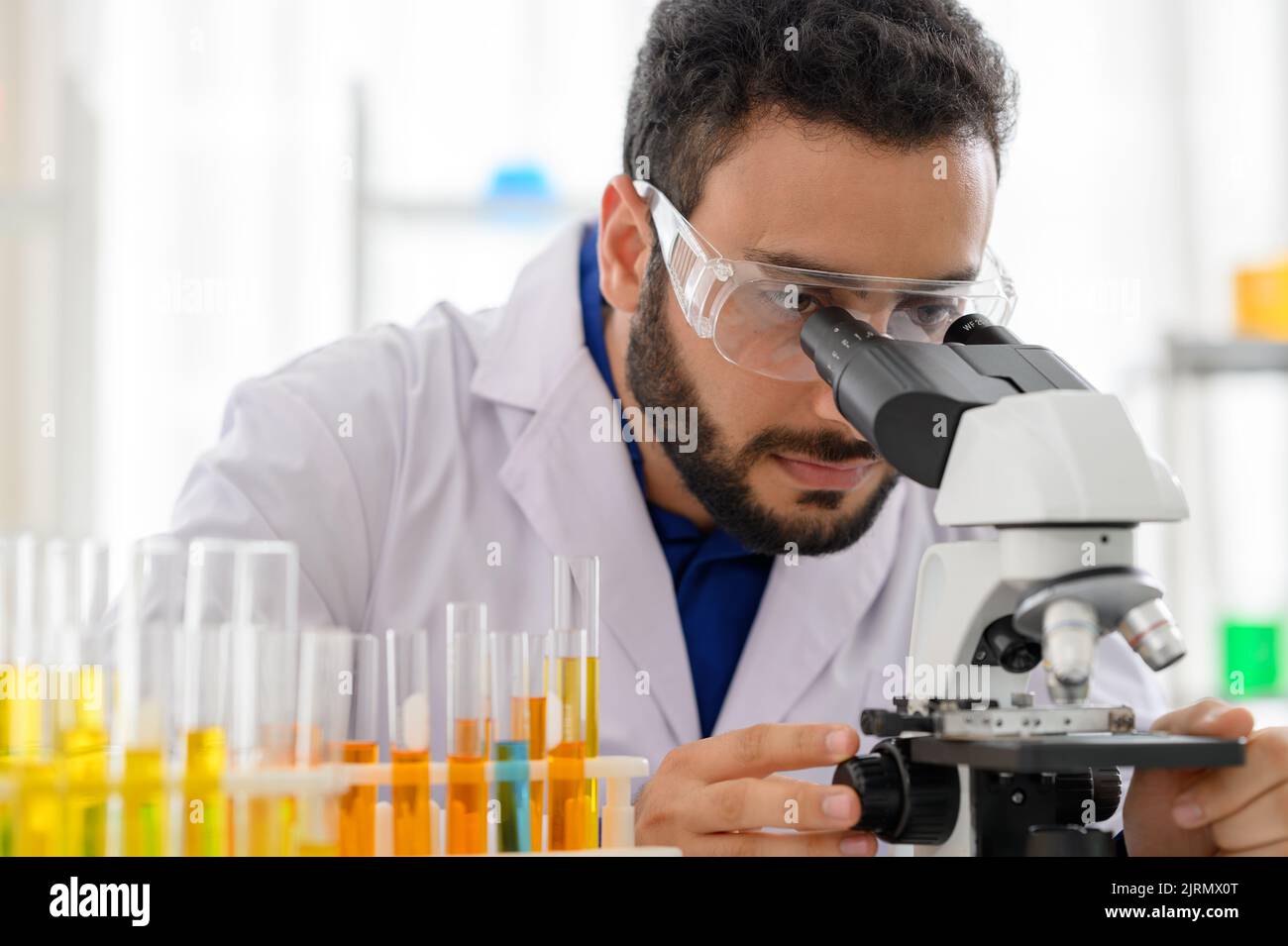 Scientist looking in microscope hi-res stock photography and images - Alamy