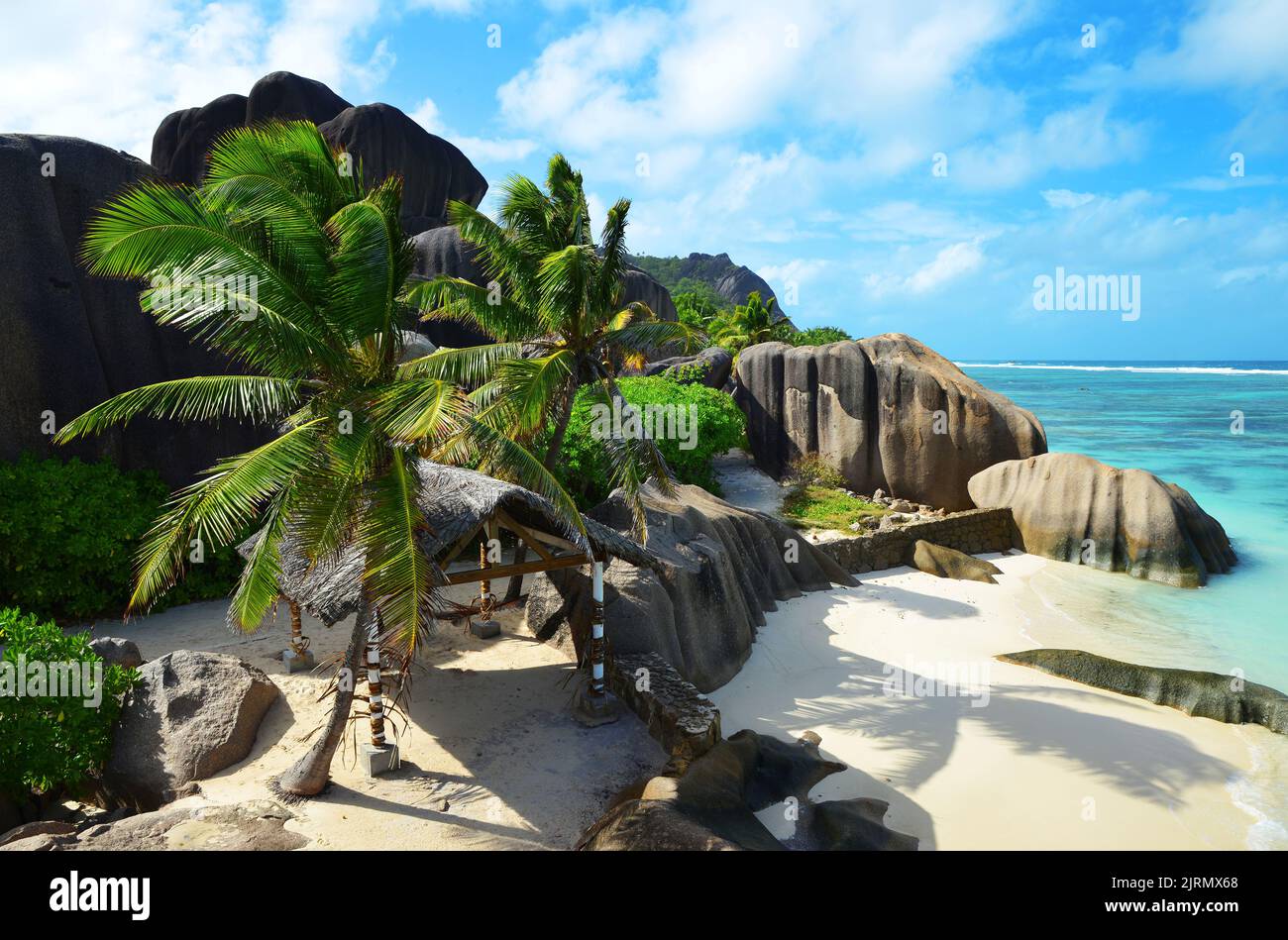 Anse Source d'Argent beach with big granite rocks in sunny day. La ...